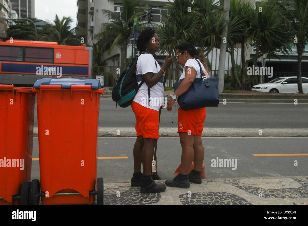 Two female garbage collectors prepare to start work at Ipanema Beach ...