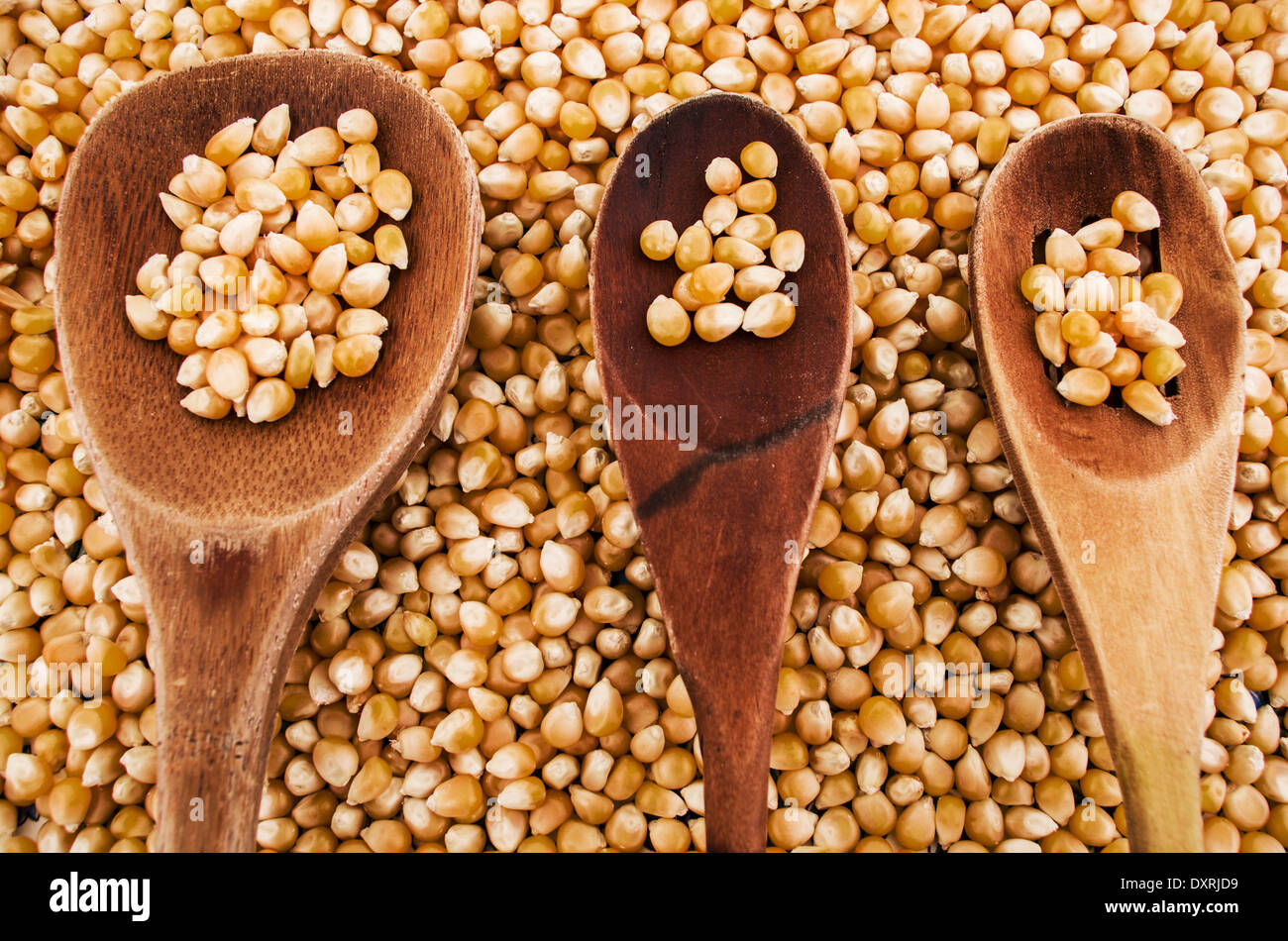wood spoon and grains Stock Photo - Alamy