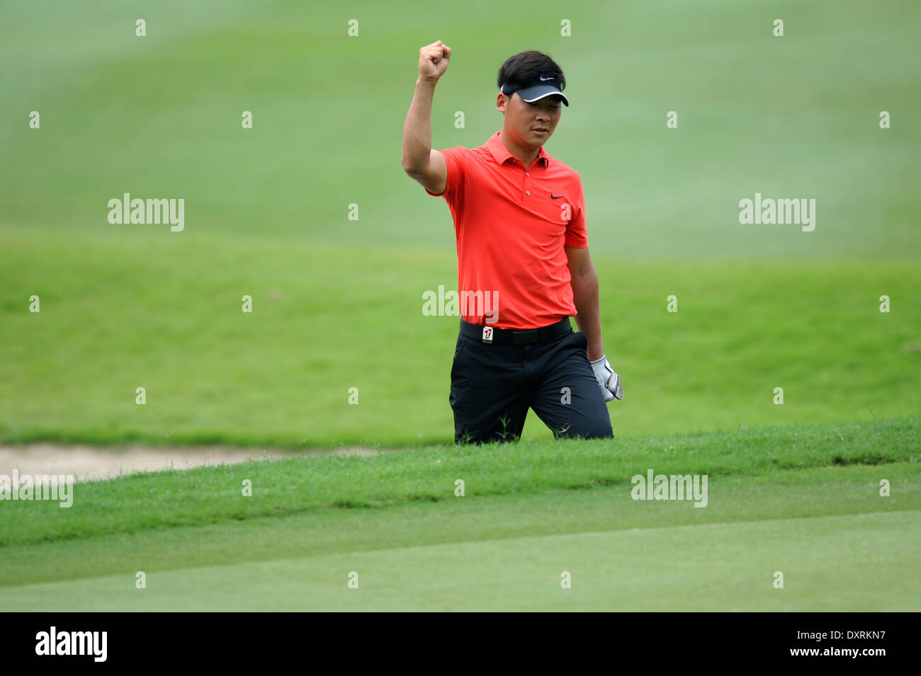 Serpong, Indonesia. 30th Mar, 2014. Zhang Xinjun of China reacts on the ...