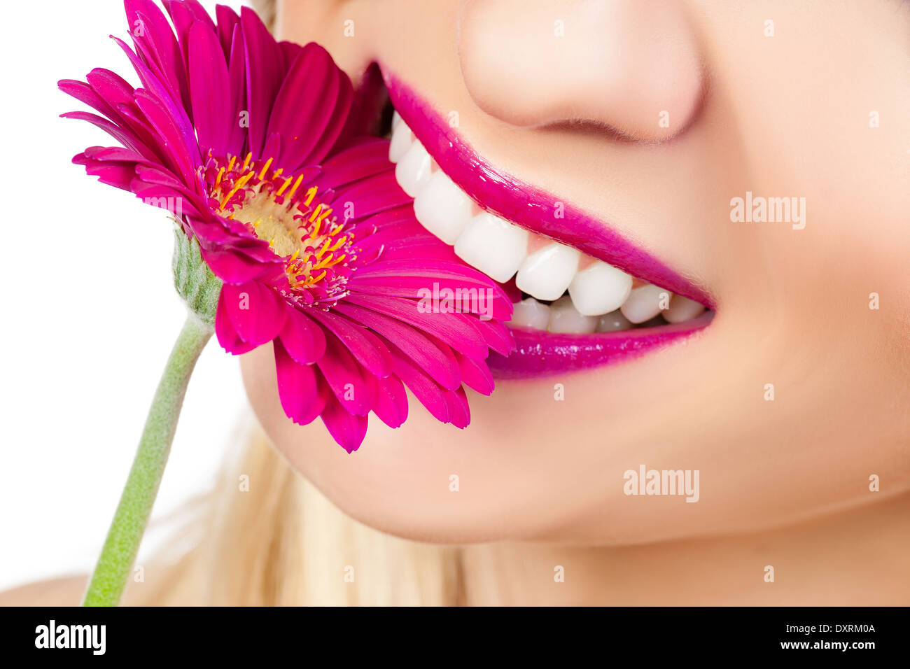 Face of a woman with a flower Stock Photo - Alamy