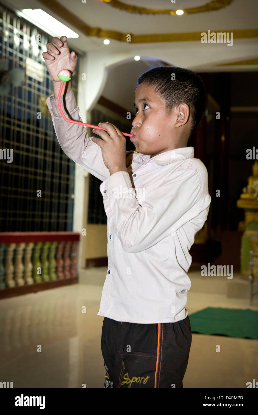 Myanmar, Tangoo, Child playing Stock Photo - Alamy