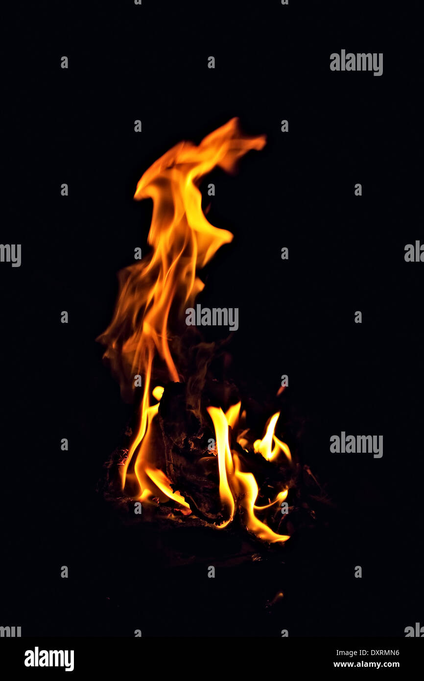 Bright fire burning in the dark closeup Stock Photo - Alamy