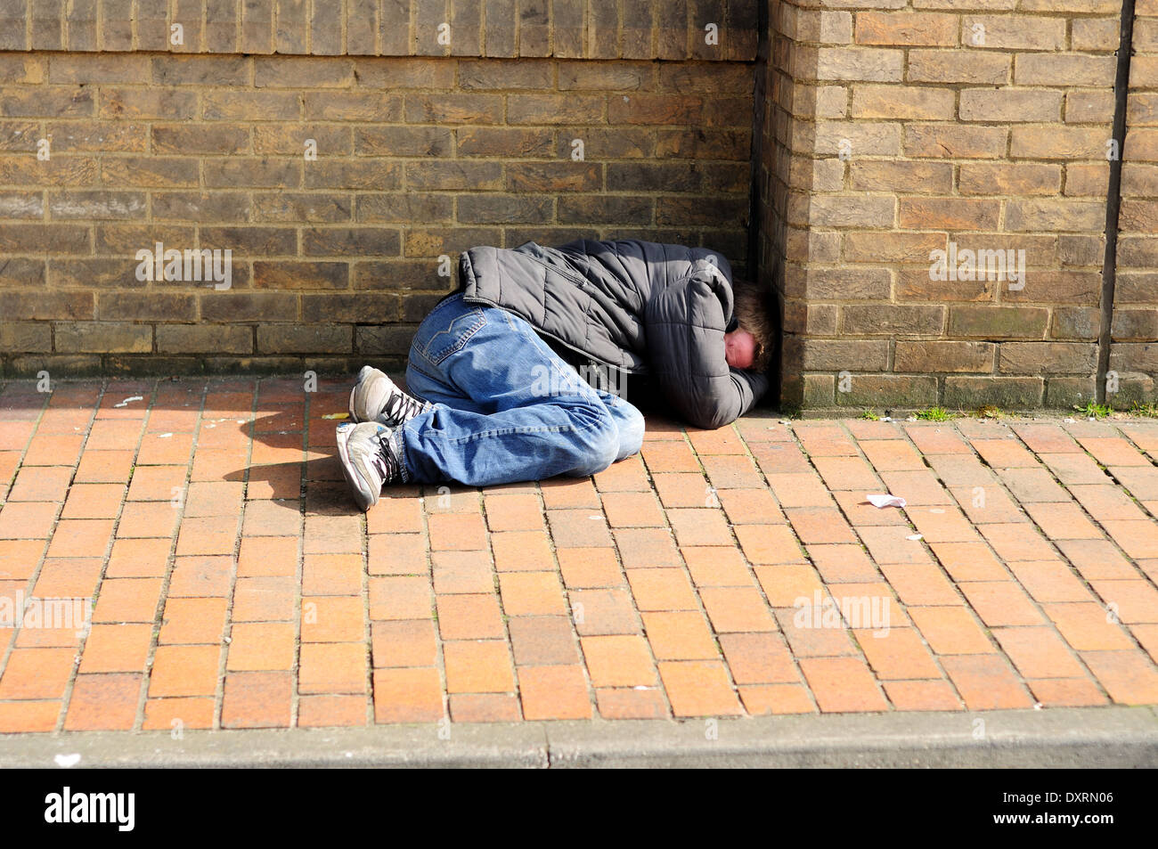 Man Sleeping On Pavement Stock Photo - Alamy