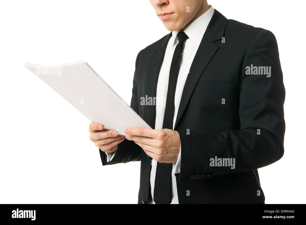 young businessman reading papers from work isolated on white background ...