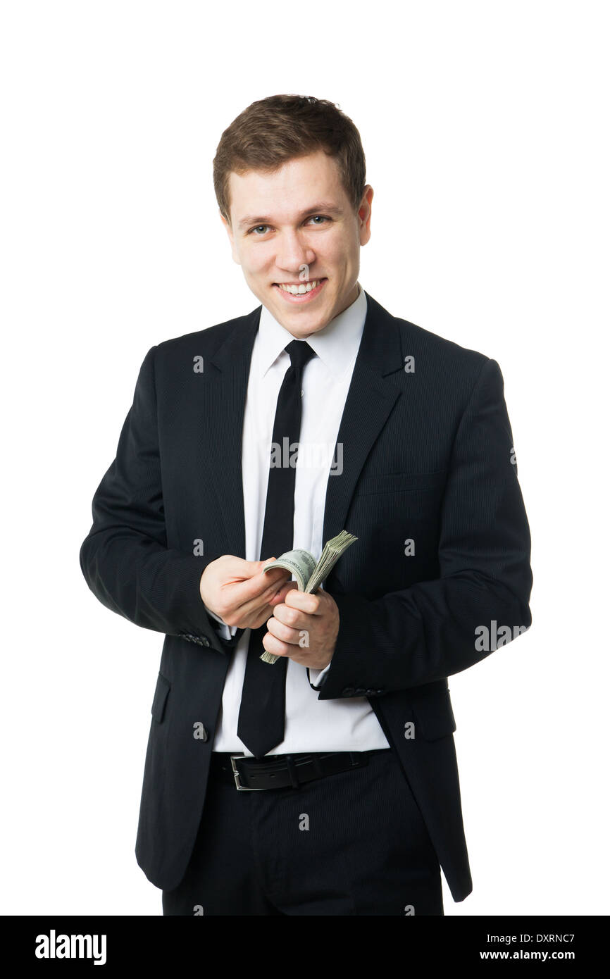 Young businessman holding money isolated over white background Stock ...