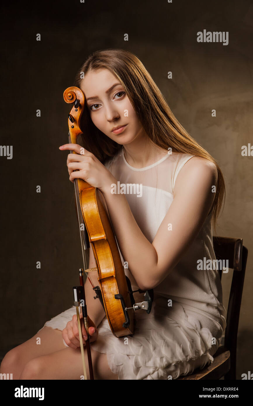 Beautiful woman playing violin hi-res stock photography and images - Alamy