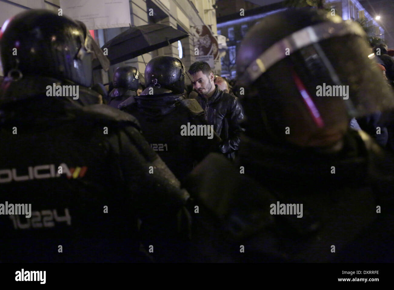 Madrid, Spain. 29th Mar, 2014. A protestor is identified by police in ...