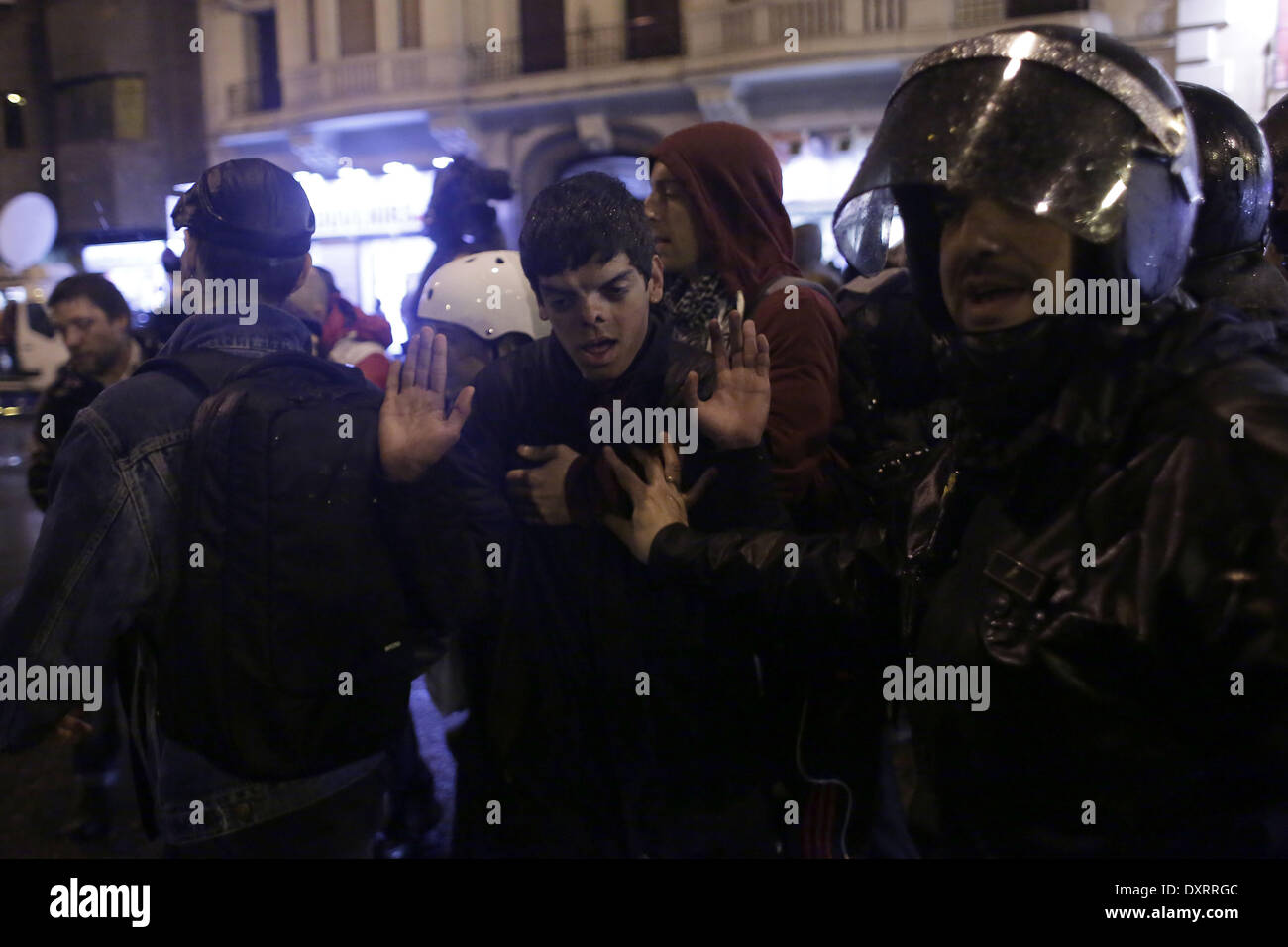 Madrid, Spain. 29th Mar, 2014. Police in riot gear pushe protestors ...