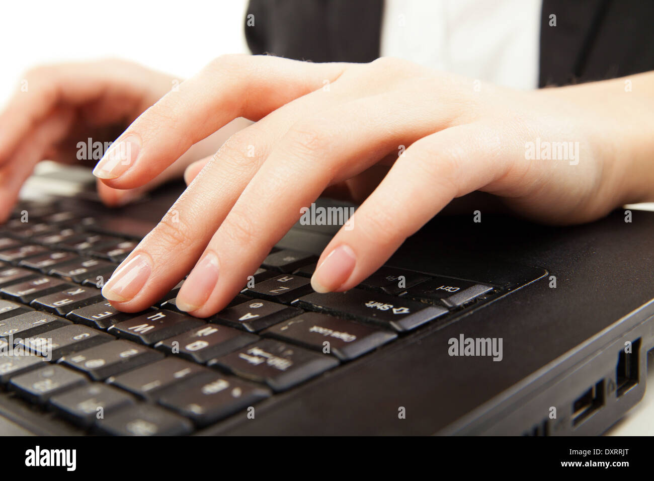 Woman hands typing on laptot, close-up, isolated over white background ...