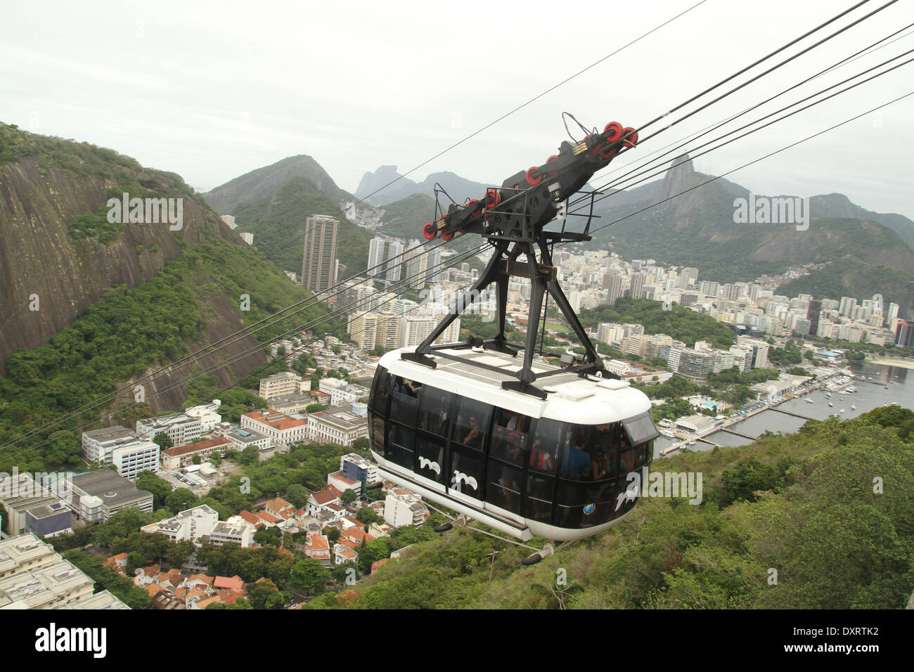A glass-walled cable car (bondinho), with a capable of 65 passengers ...