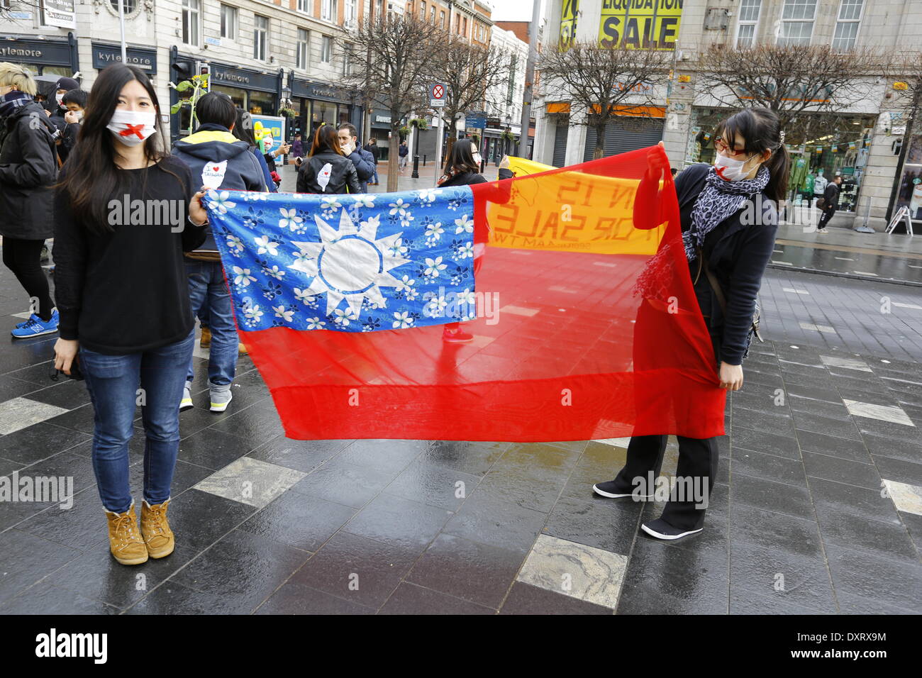 Dublin, Ireland. 30th March 2014. Protesters hold a Taiwanese flag ...