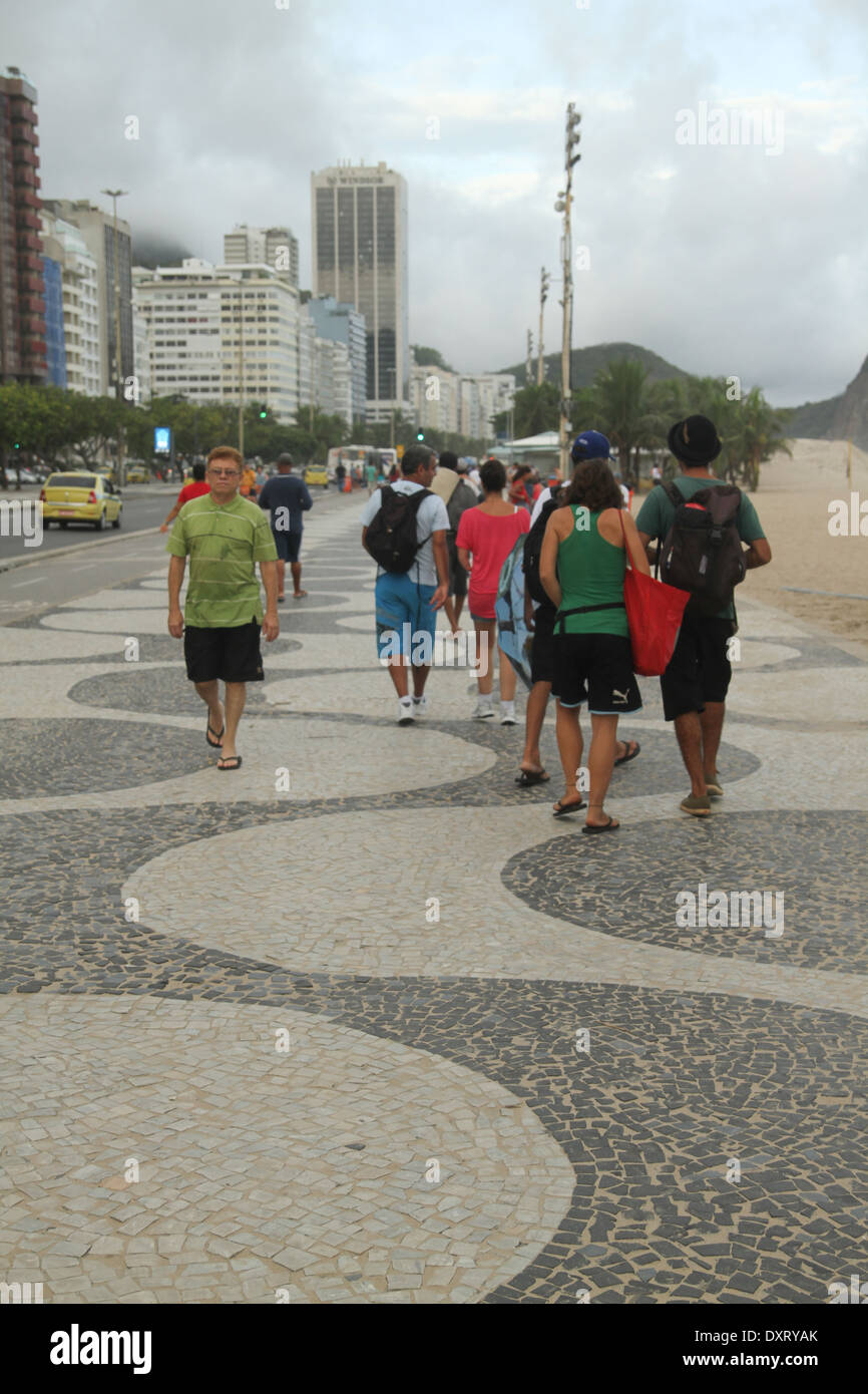 People seen walking on a footpath at the Copacabana Beach in Rio de ...
