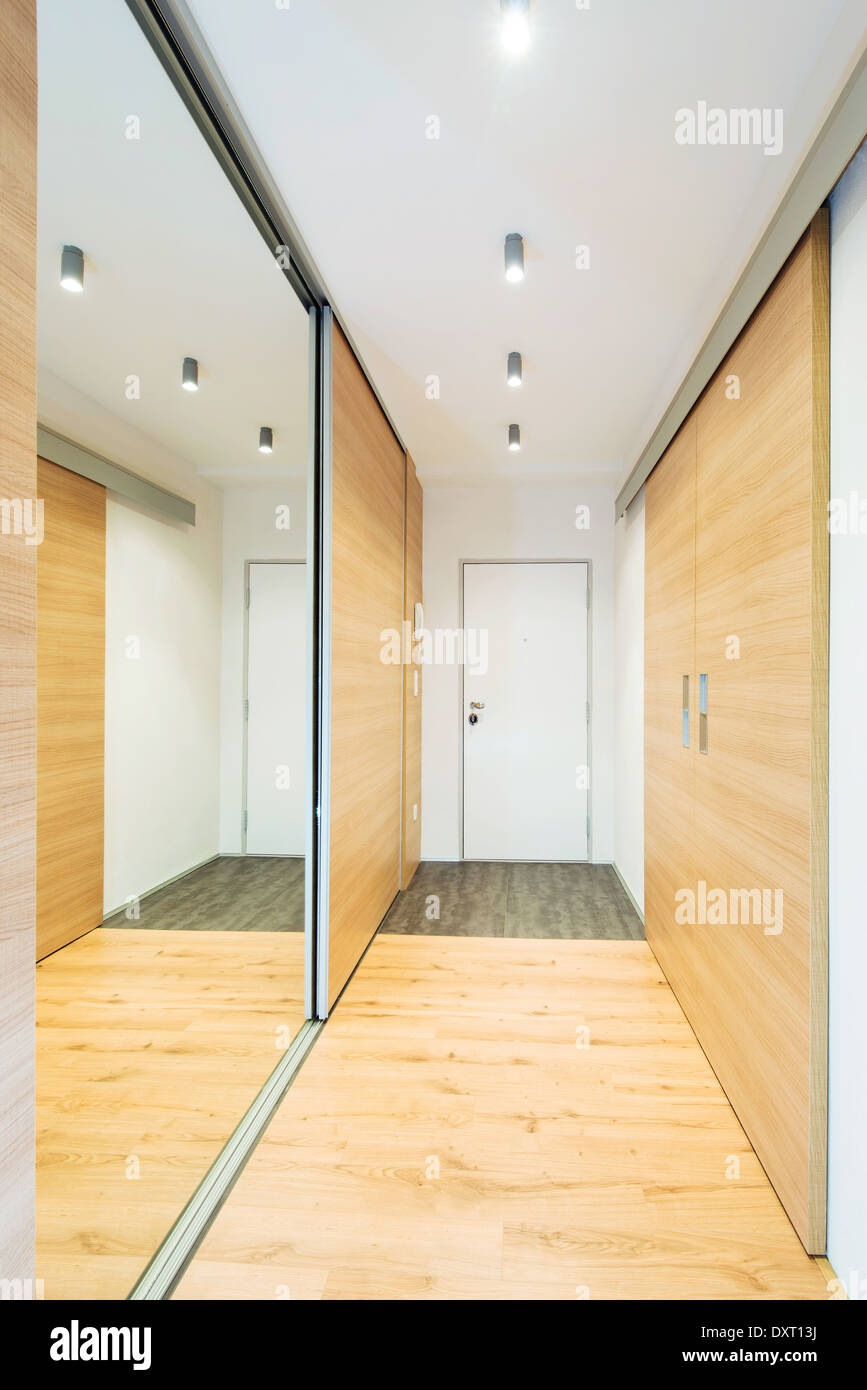 entrance hall with mirror in modern apartment Stock Photo - Alamy
