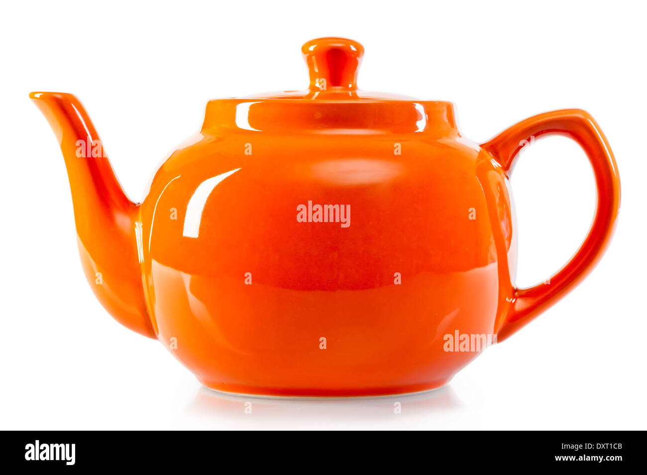 bright orange teapot on a white background Stock Photo - Alamy