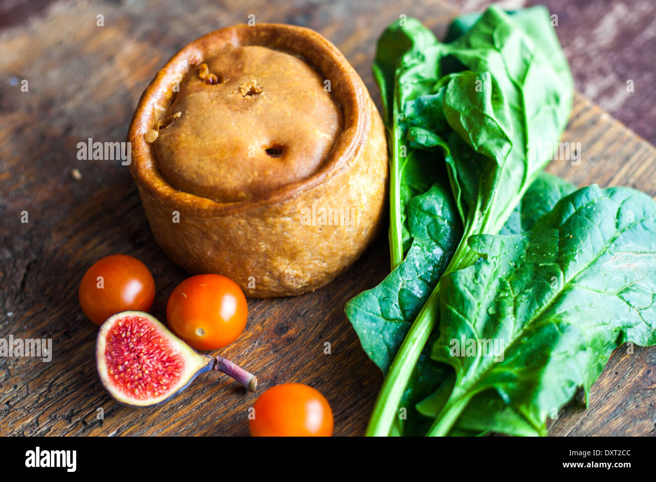 A pork pie ready to eat Stock Photo - Alamy