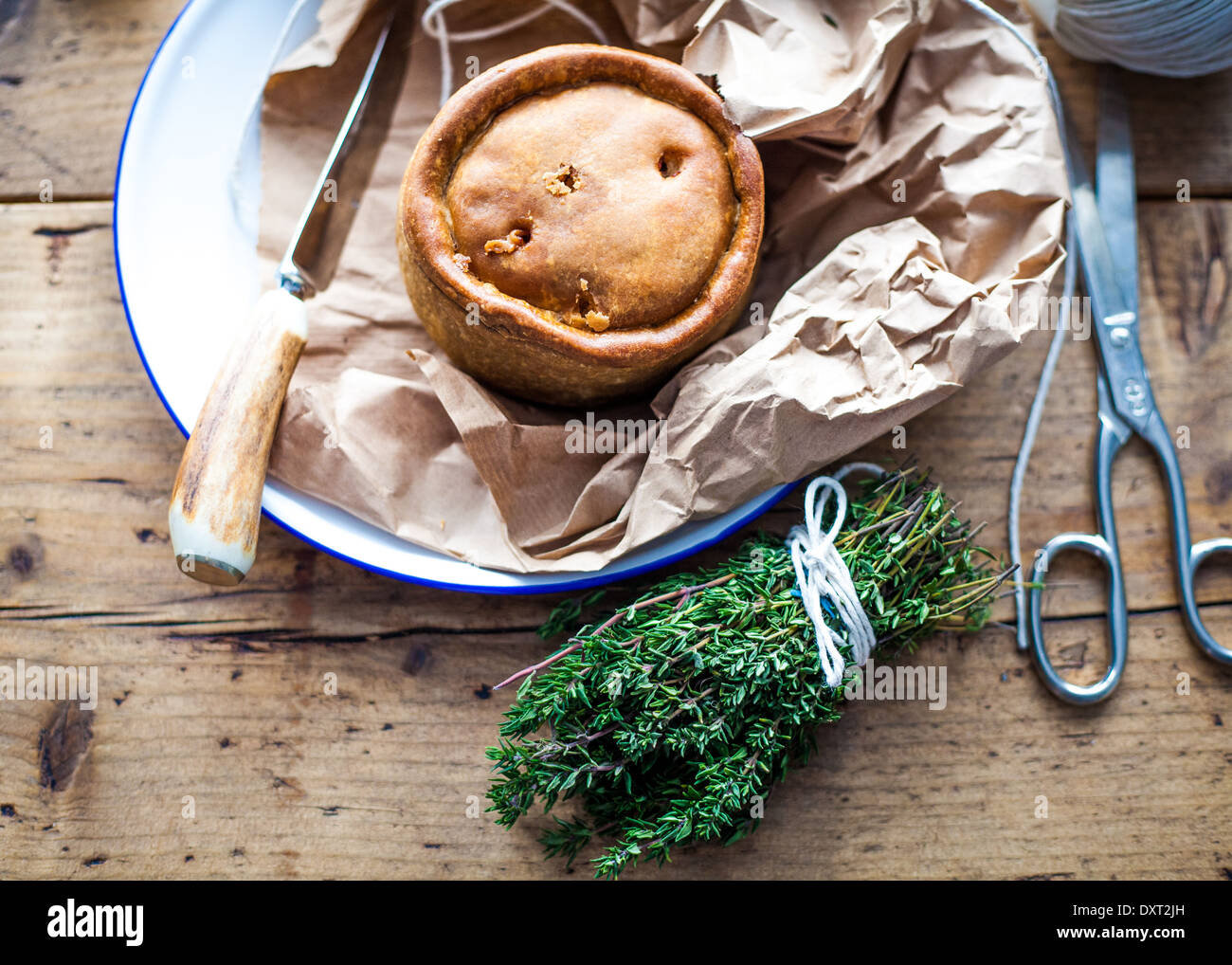 A pork pie ready to eat Stock Photo - Alamy