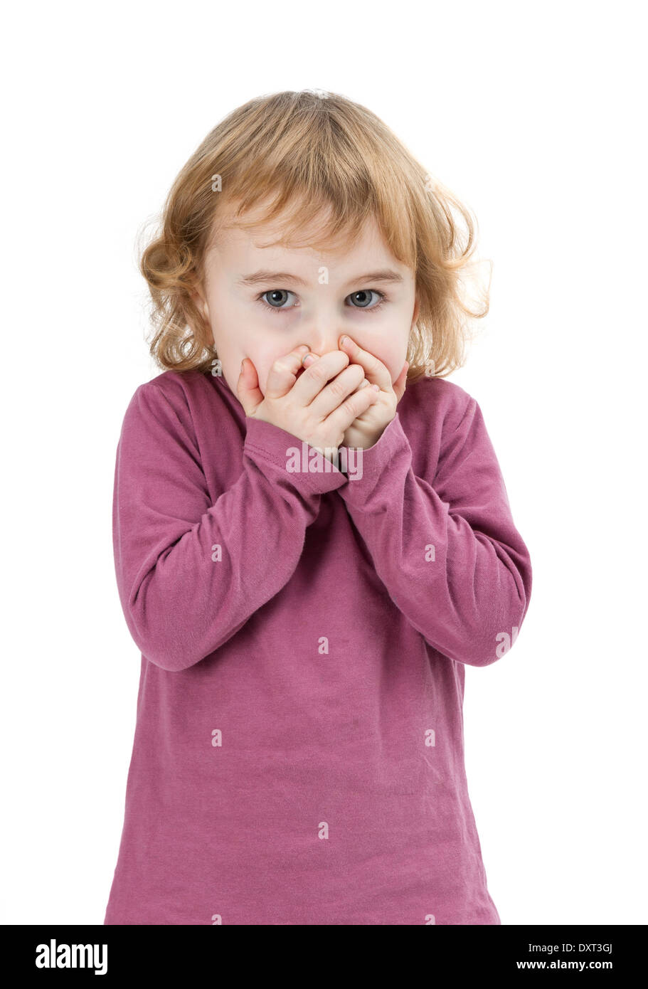 preschooler holding hands on mouth. to be silent. vertical image ...