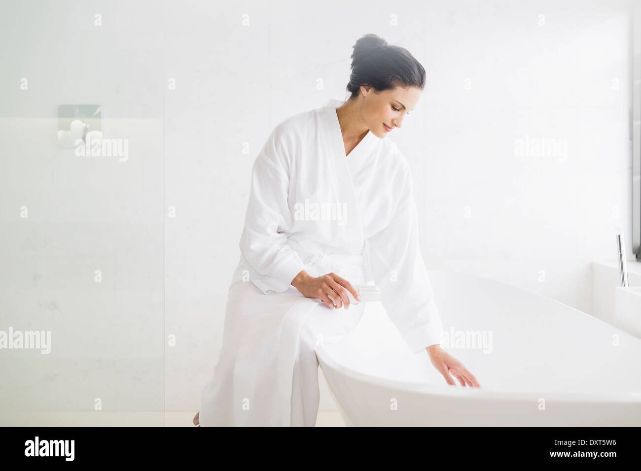 Woman pouring water bath hi-res stock photography and images - Alamy
