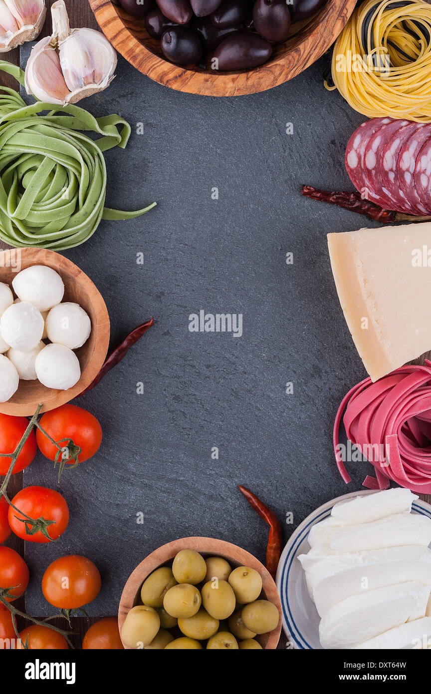 Typical Italian products on black board Stock Photo - Alamy
