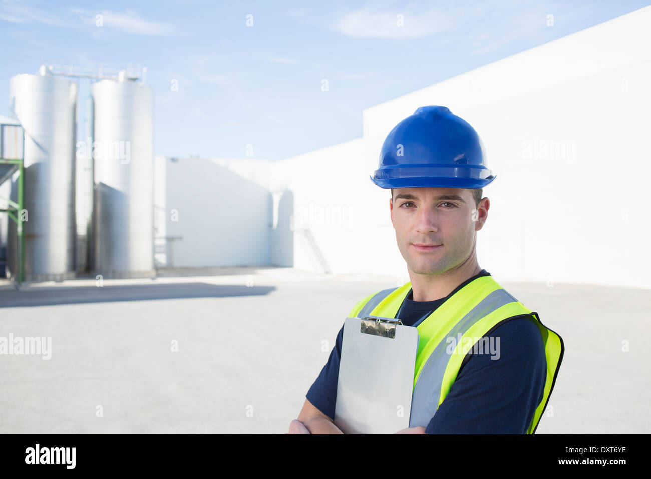 Portrait of confident worker with clipboard at granary Stock Photo - Alamy