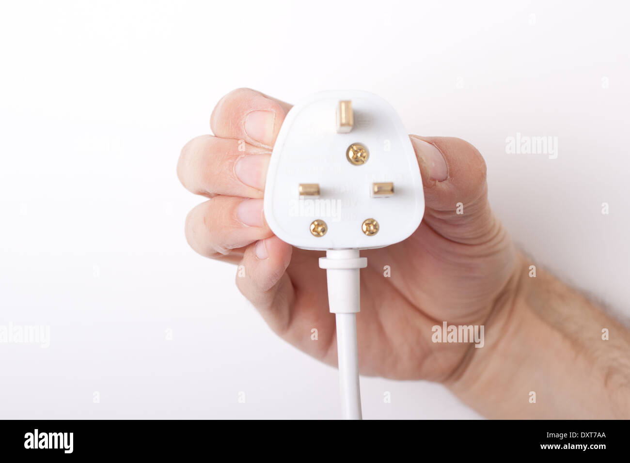 Hand holding an electrical plug Stock Photo - Alamy