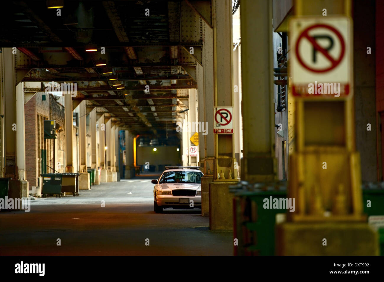 Downtown Chicago Alley Under Train Tracks and Police Cruiser Parked in ...