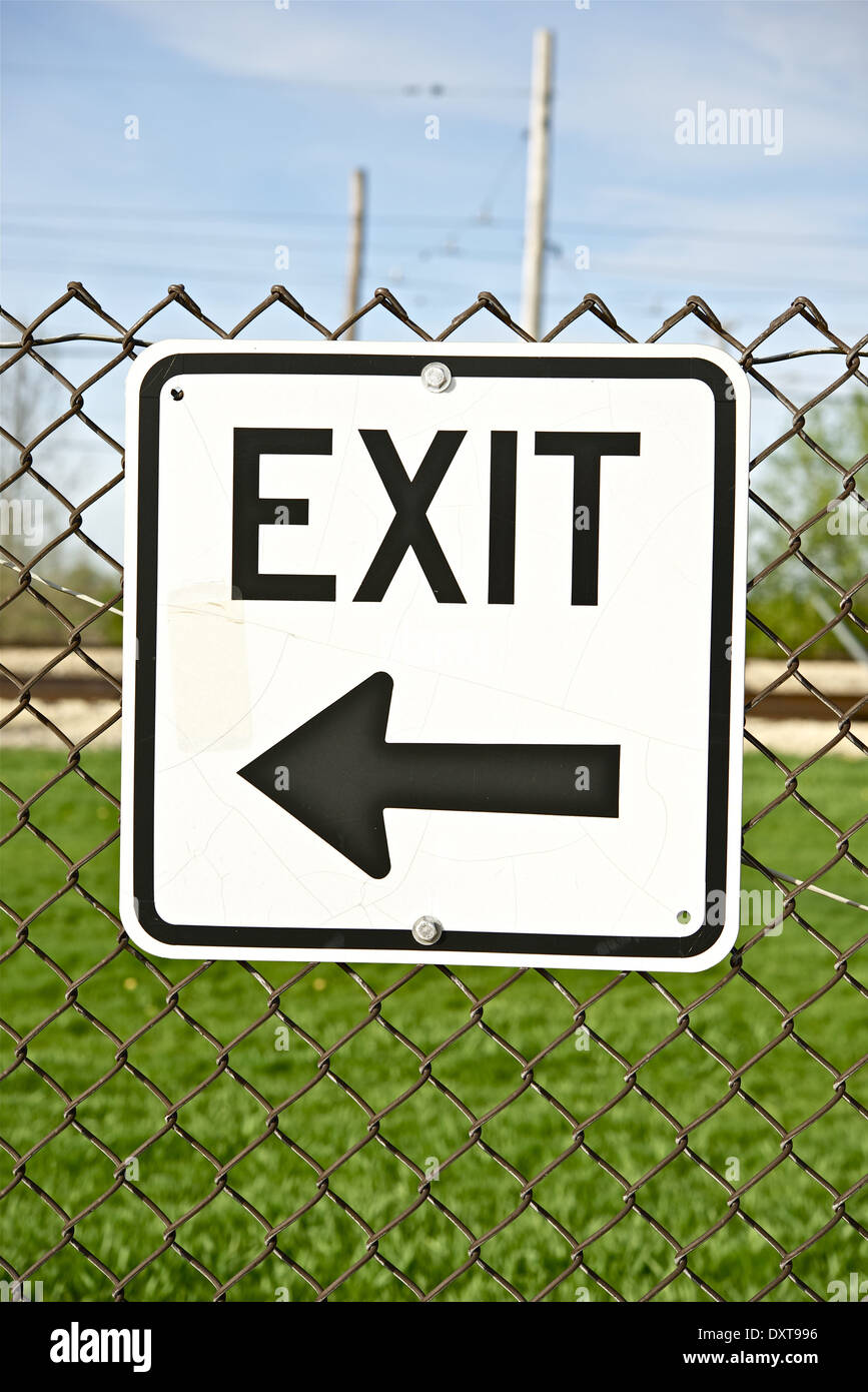 Exit Sign on the Fence. Black Arrow Showing the Right Way to Exit ...