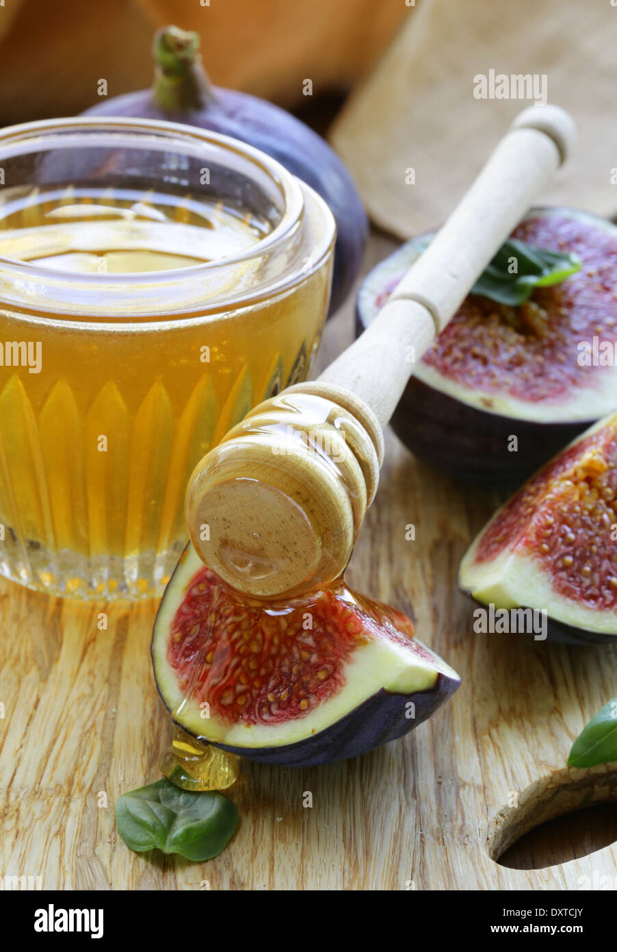 Fresh ripe figs and light honey - a healthy dessert Stock Photo - Alamy