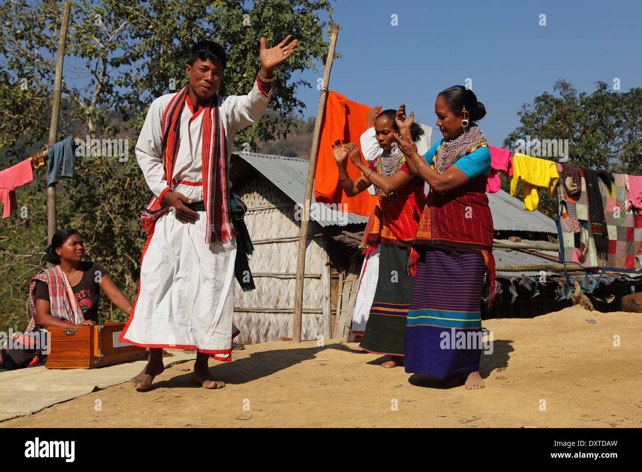 Men and women of the Tripura tribe dancing in their village in the ...