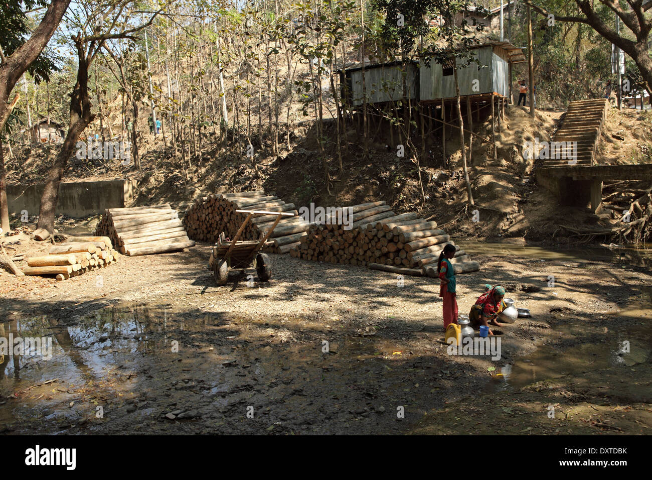 Women fetch water from wells in the Bandarban region of Bangladesh ...