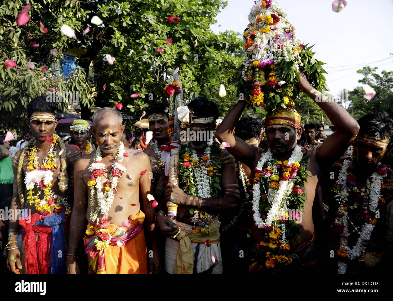 Yangon, Myanmar. 30th Mar, 2014. Hindu devotees celebrate a traditional ...
