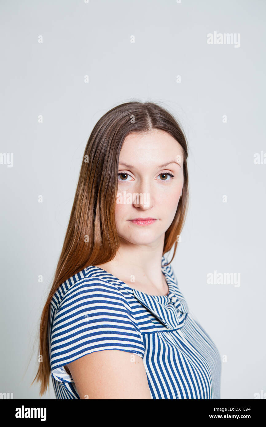 Studio portrait of serious looking attractive and stylish woman Stock ...