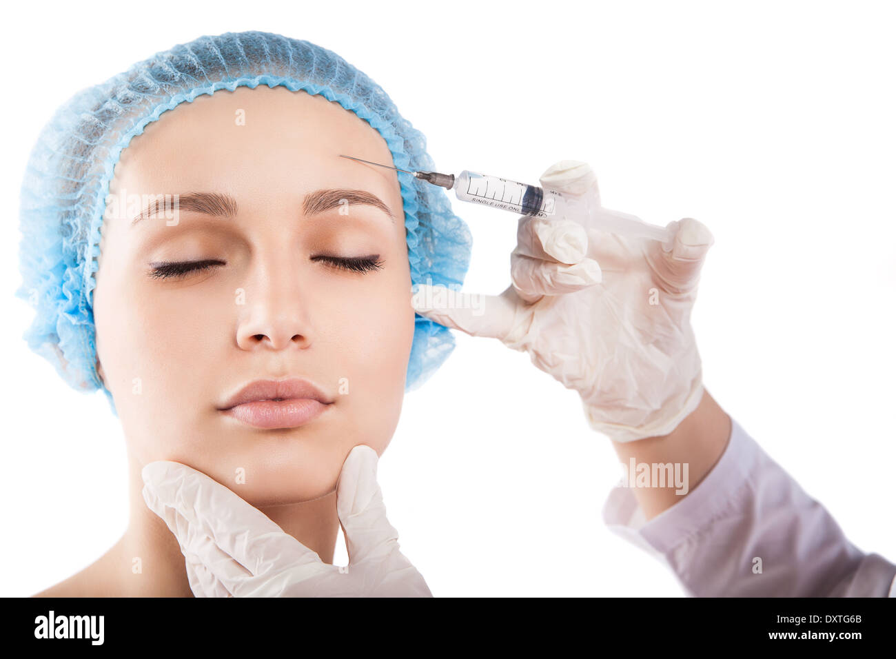 Cosmetic injection to the pretty woman face isolated over white Stock ...