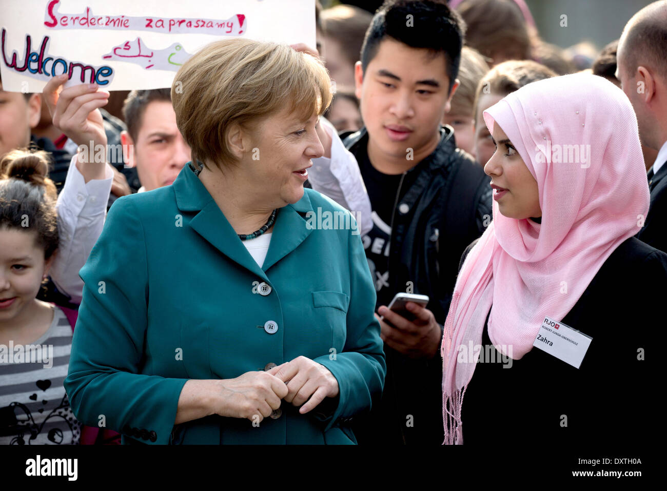 German Chancellor Angela Merkel (CDU) speaks with student Zahra during ...
