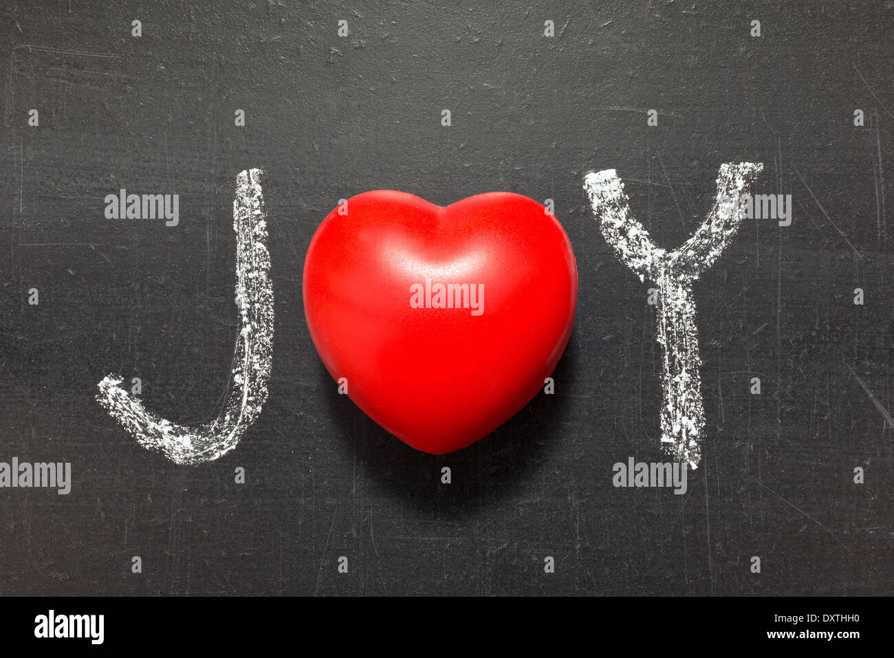 joy word handwritten on chalkboard with heart symbol instead of O Stock ...