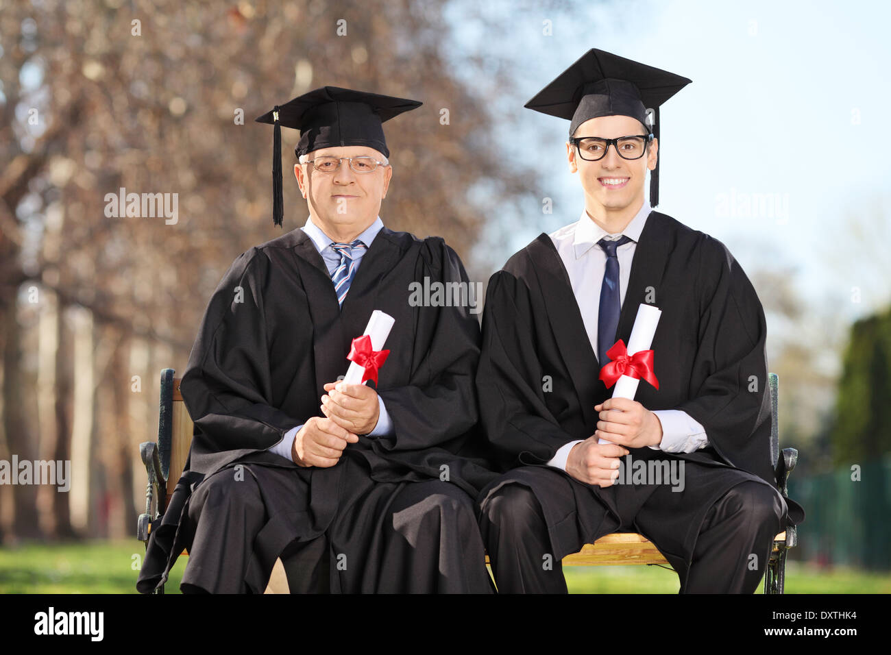 Professor and student posing on a bench in park Stock Photo - Alamy