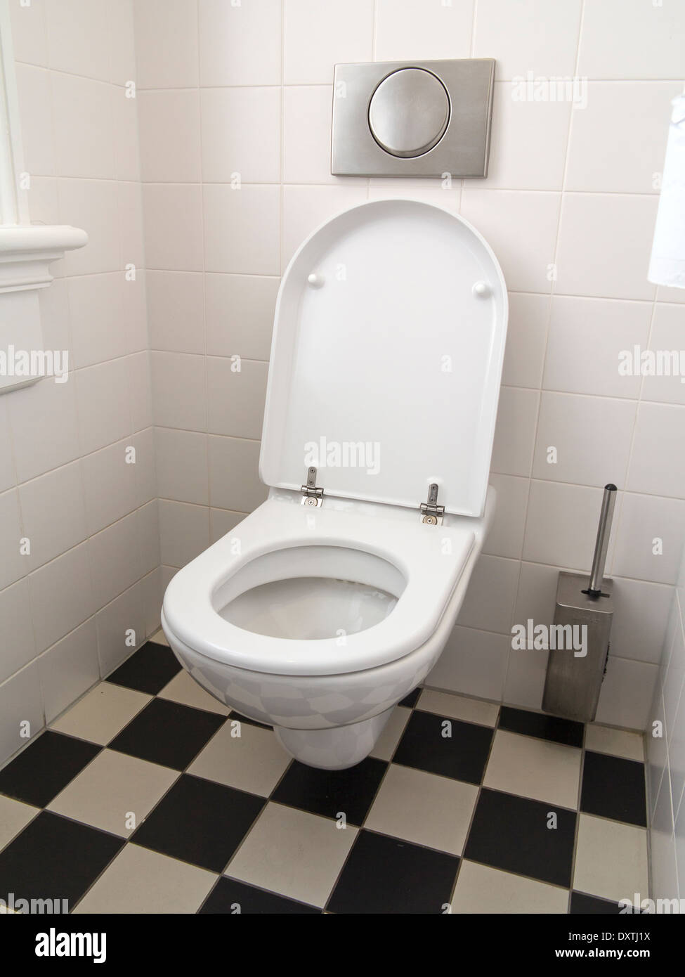 Wall mounted white ceramic toilet Stock Photo - Alamy