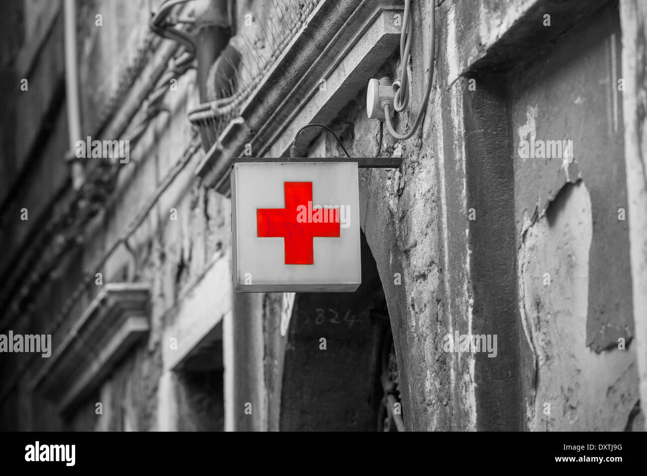 Red cross sign on building in Venice, Italy Stock Photo - Alamy