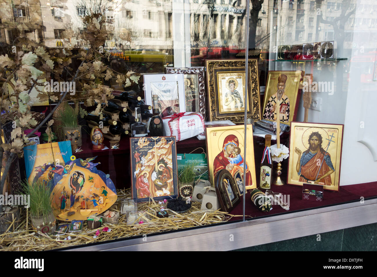 Orthodox religious icons and other items in a window store in Belgrade ...