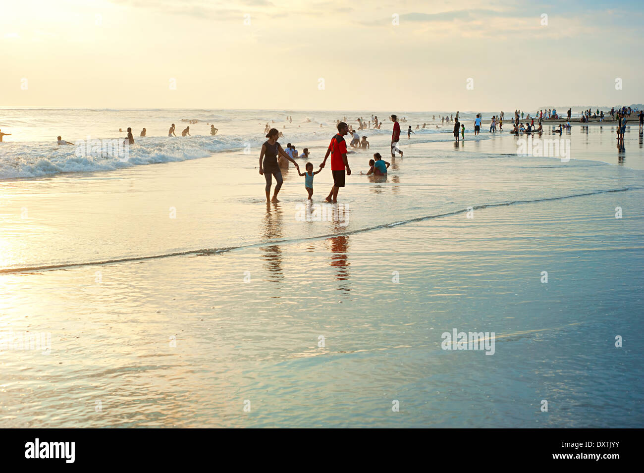 Local people resting at the ocean beach on Bali island Stock Photo - Alamy