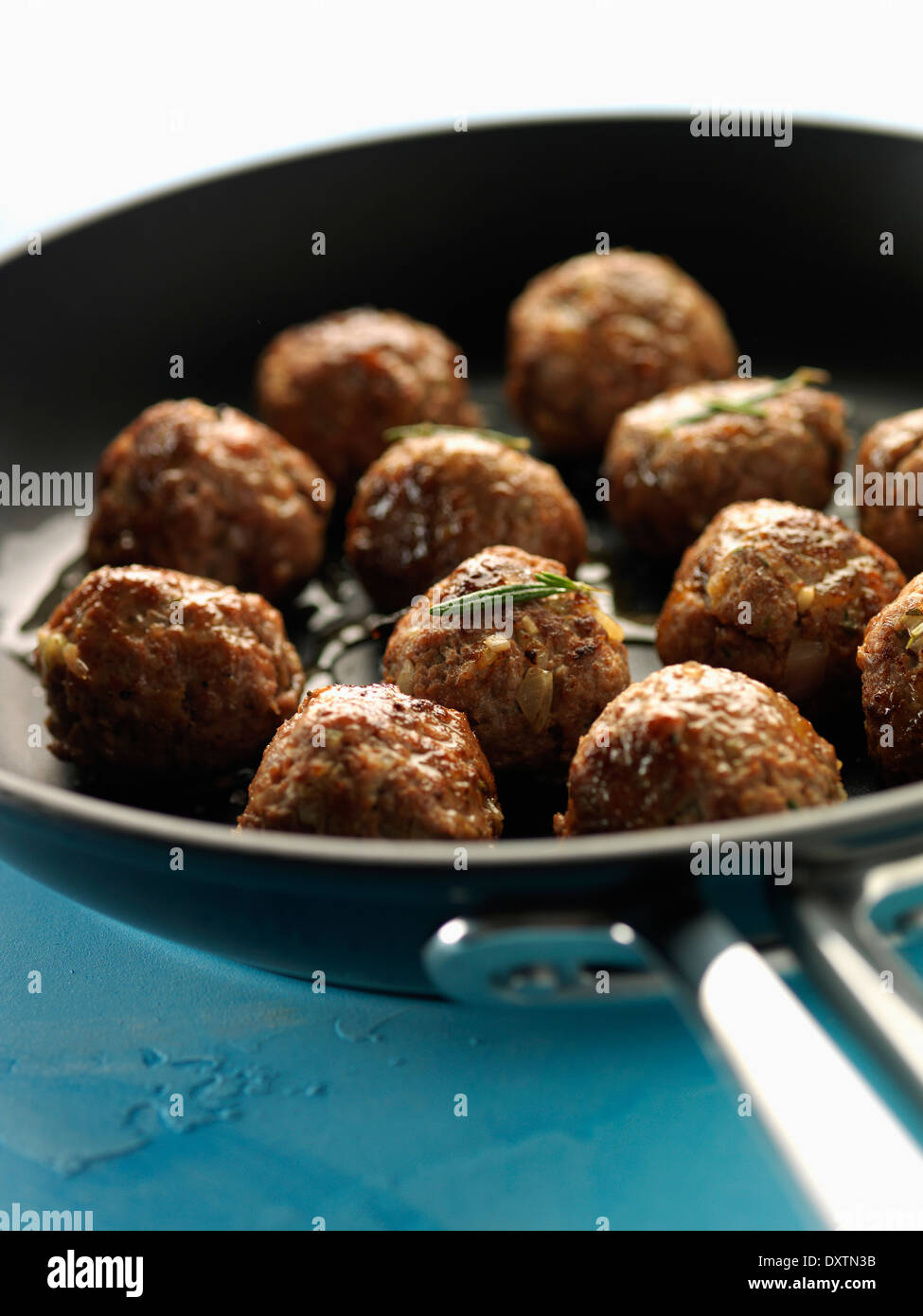 Cooking meatballs in a frying pan Stock Photo - Alamy