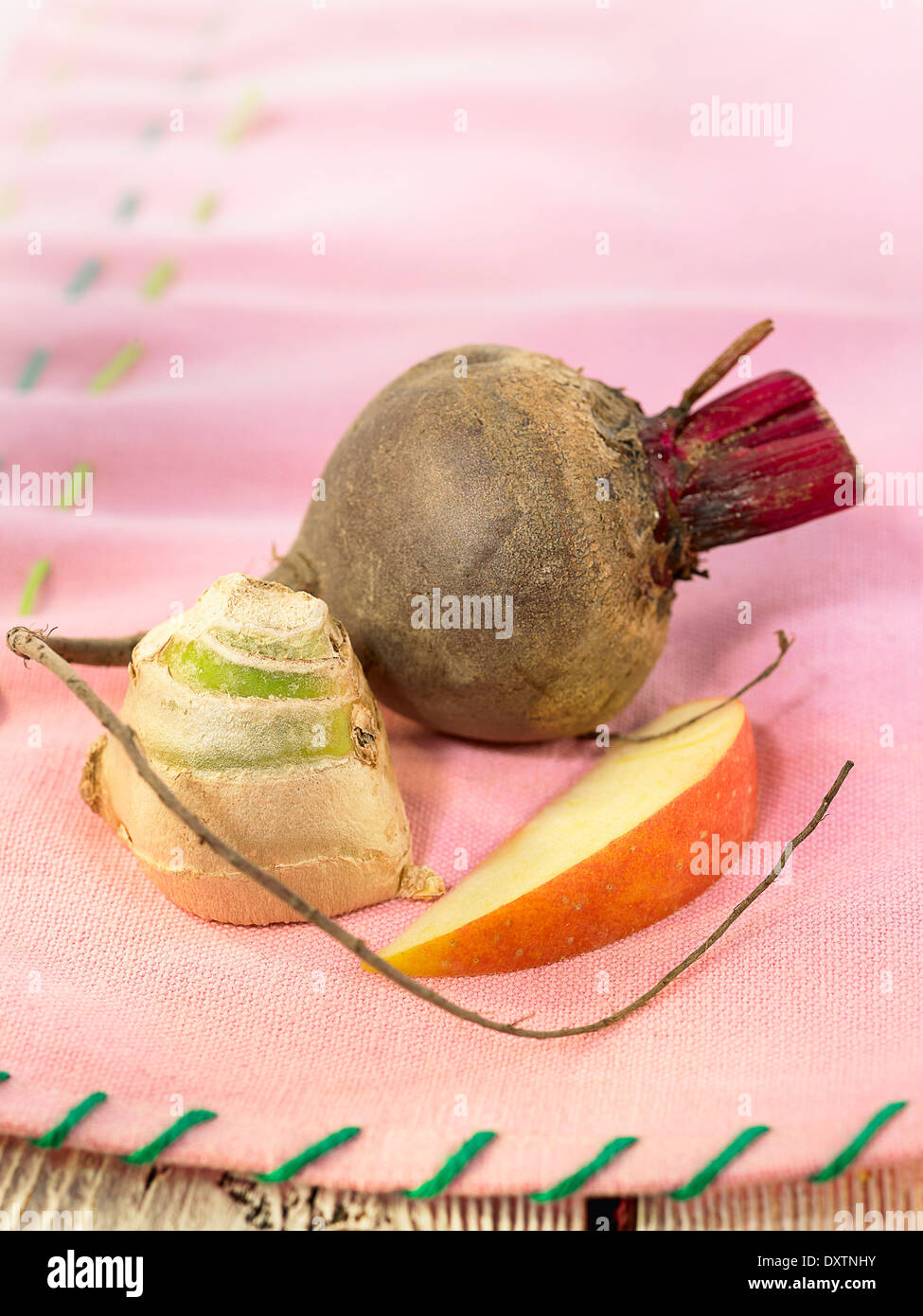 beetroot,ginger root and a slice of apple Stock Photo - Alamy
