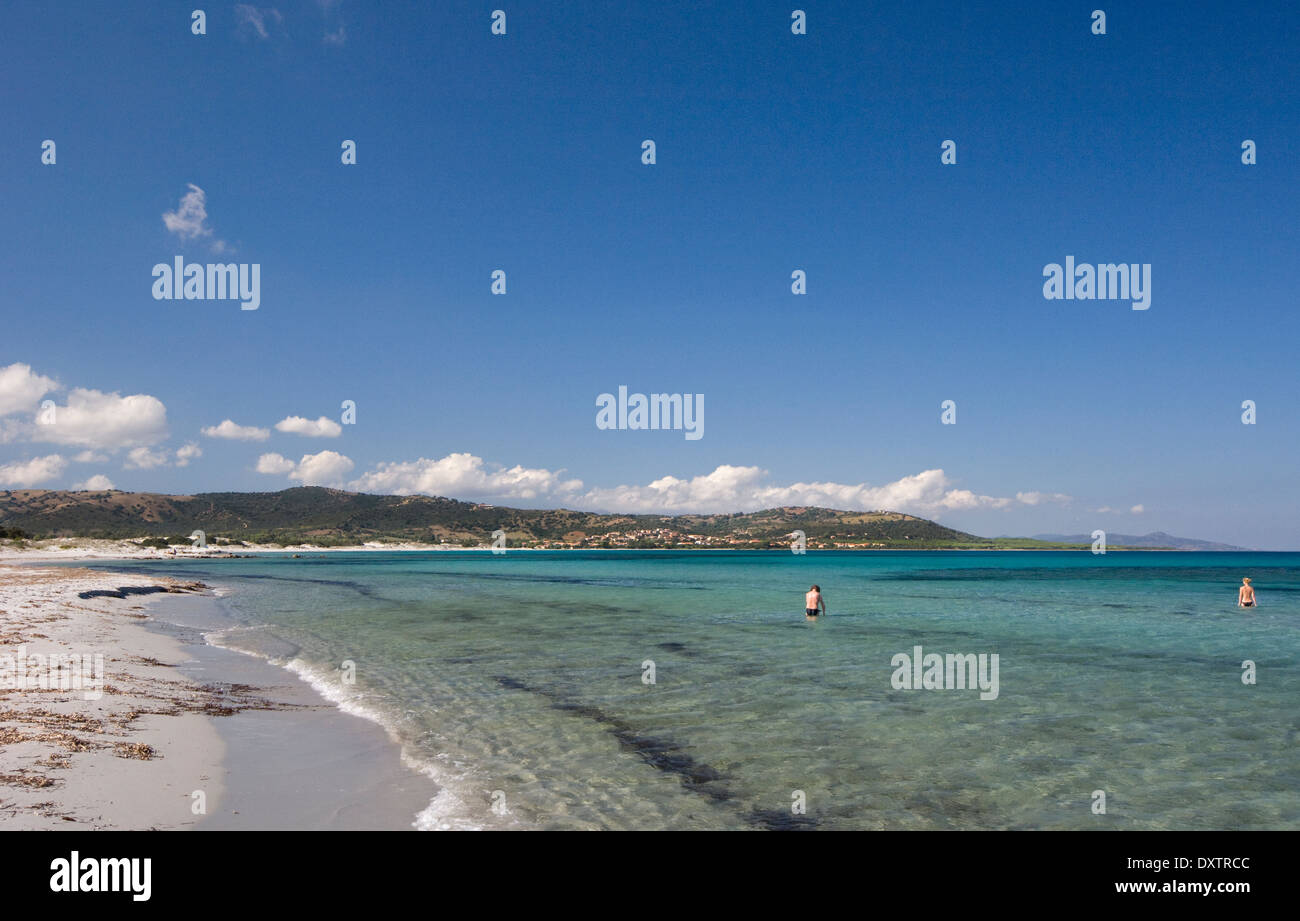 Tourists enjoy the transparent Mediterranean sea at Capo Comino beach ...