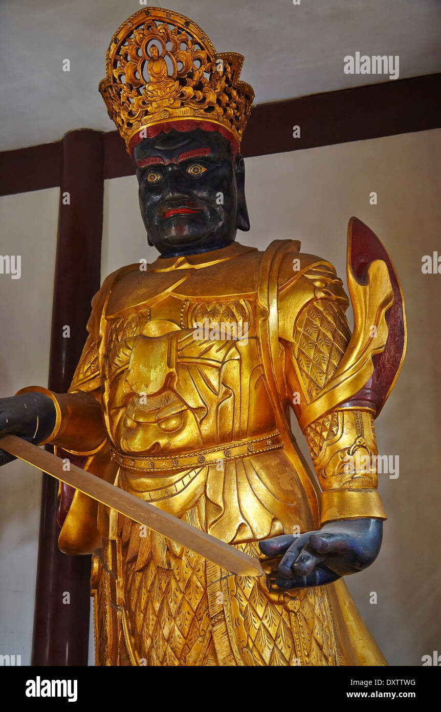 Statue of a guardian deity hi-res stock photography and images - Alamy