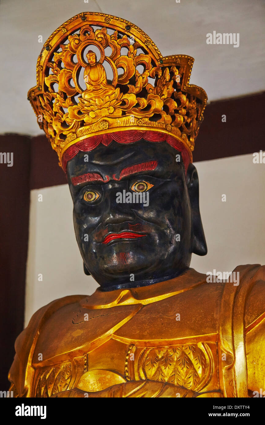 Statue of a guardian deity hi-res stock photography and images - Alamy