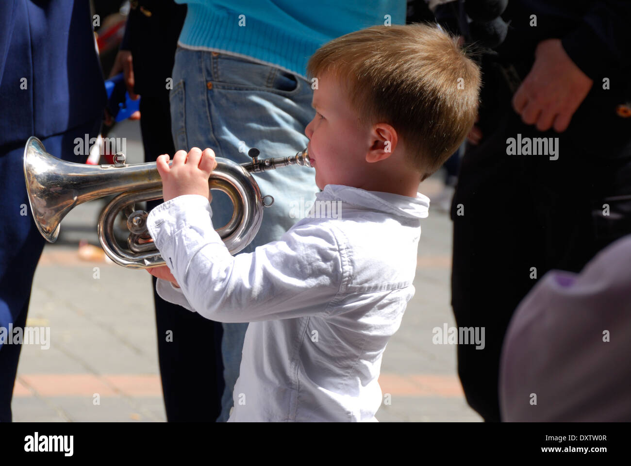 Young spectator, playing along with Catral Cornet and Drum Band Stock ...