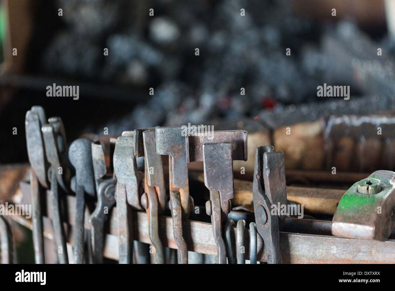 Tools of the blacksmith in blacksmith shop Stock Photo - Alamy