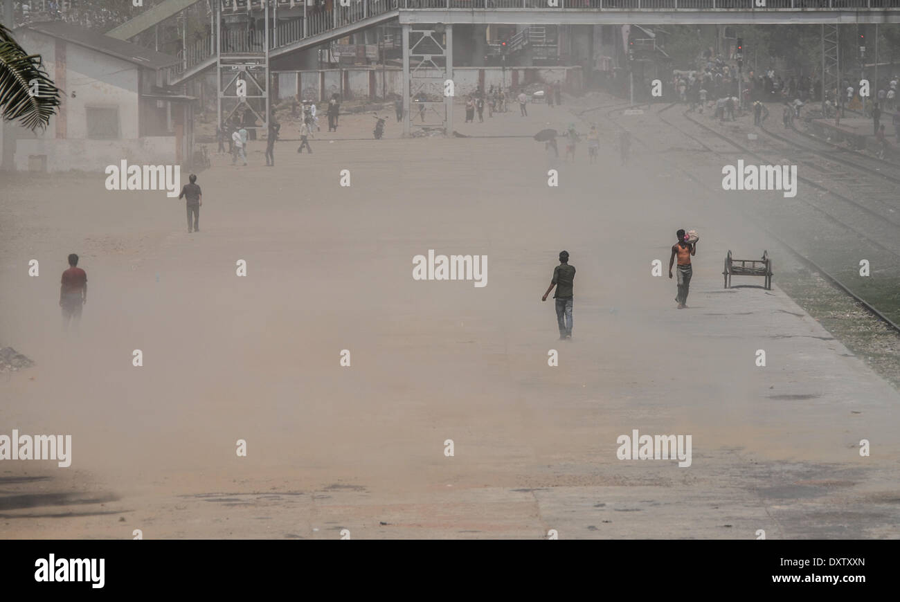 Dimapur, India. 31st Mar, 2014. Indian pedestrian walk pass against the ...