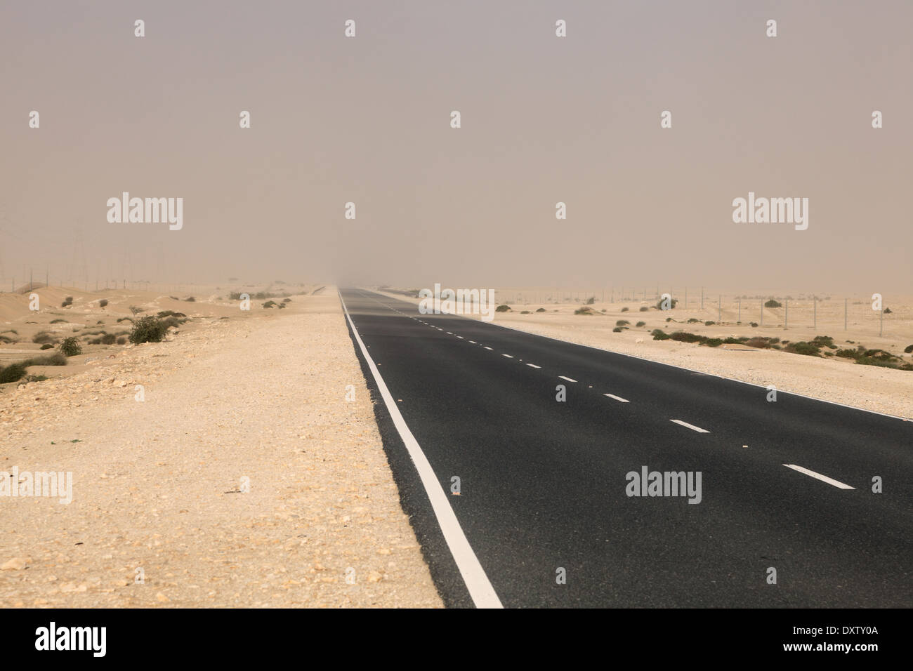 Road through the desert in western Qatar, Middle East Stock Photo - Alamy