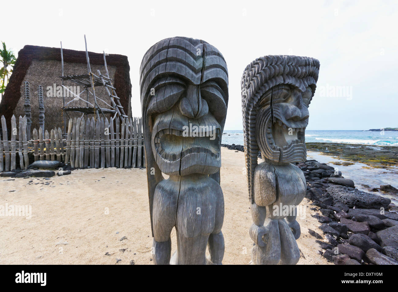 Two carved statues on the beach of City of Refuge National Historical ...